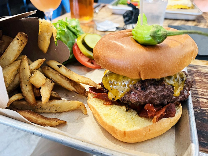 Behold the McCabe Burger in its natural habitat. That melty cheese cascade and golden brioche bun are the stuff of late-night food fantasies.