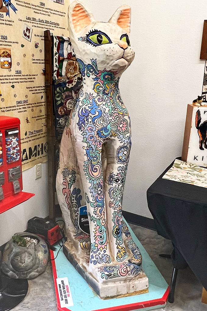 This elaborately decorated cat statue combines folk art tradition with feline form. Like a psychedelic dream a cat might have after eating catnip.