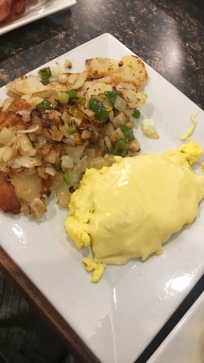 Golden potatoes mingling with eggs and a symphony of onions. The kind of breakfast that makes you cancel lunch plans immediately.