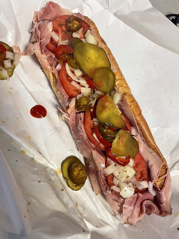 The Italian hoagie in its natural habitat—simple white paper that will soon bear the beautiful stains of oil, vinegar, and culinary commitment.