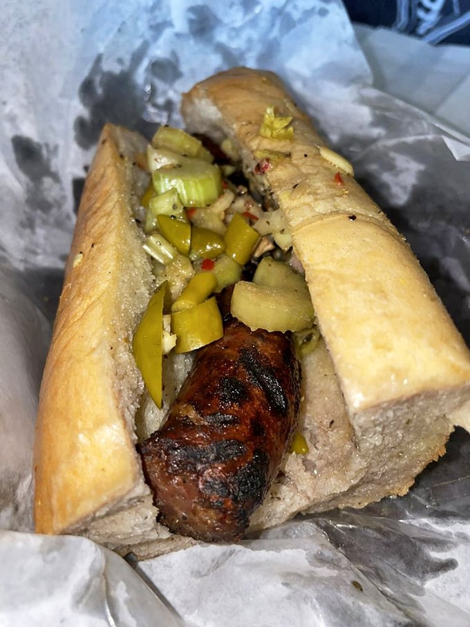 The Italian sausage sandwich: charred exterior, juicy interior, topped with giardiniera that bites back. A beautiful Chicago love story.