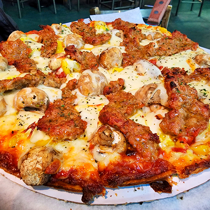 When Italian sausage meets mushrooms, magic happens. This pizza doesn't need fancy words &ndash; it lets those golden-brown edges do all the talking.