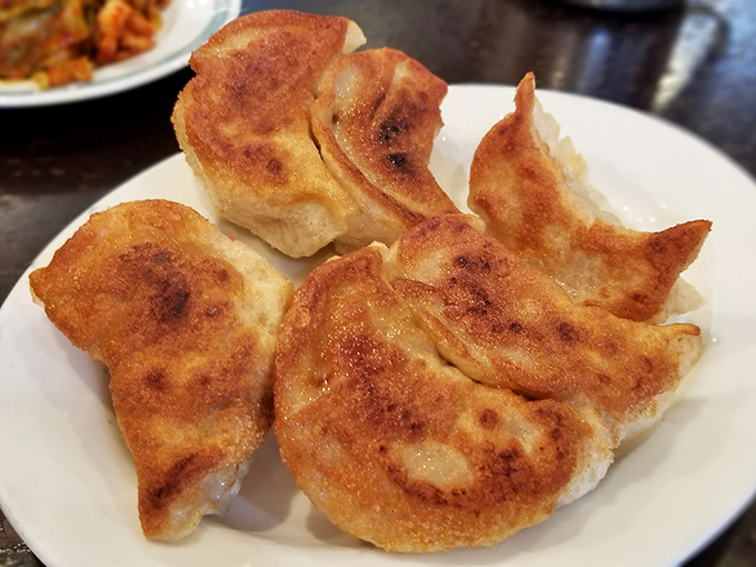 Pan-fried potstickers with perfectly crisped bottoms &ndash; the mullets of the dumpling world. Business on top, party on the bottom.