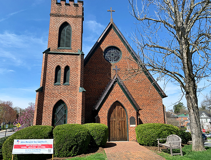 Johns Memorial Episcopal Church stands as a red-brick testament to timeless craftsmanship, its steeple reaching skyward as it has for generations of Farmville faithful.