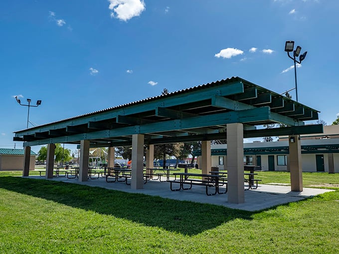 Keenan Park's covered picnic area provides blessed shade during hot valley summers, a gathering spot where community happens over shared meals.