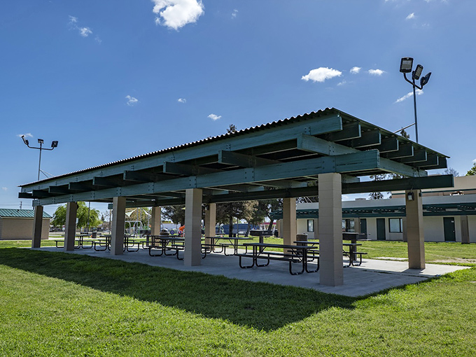 Keenan Park's covered picnic area provides blessed shade during hot valley summers, a gathering spot where community happens over shared meals.