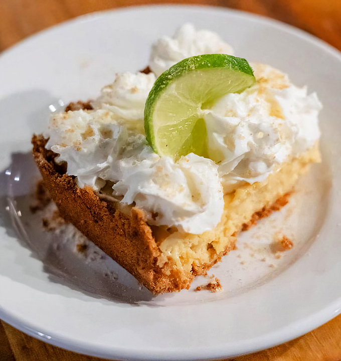 Key lime pie topped with a cloud of whipped cream and a lime slice that's not just garnish&mdash;it's the exclamation point on a sweet-tart masterpiece.