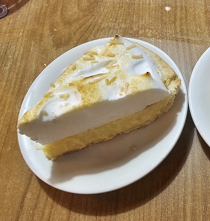 Key lime pie that strikes the perfect balance between tart and sweet—like Florida sunshine in dessert form, unexpectedly perfect after a mountain of seafood.