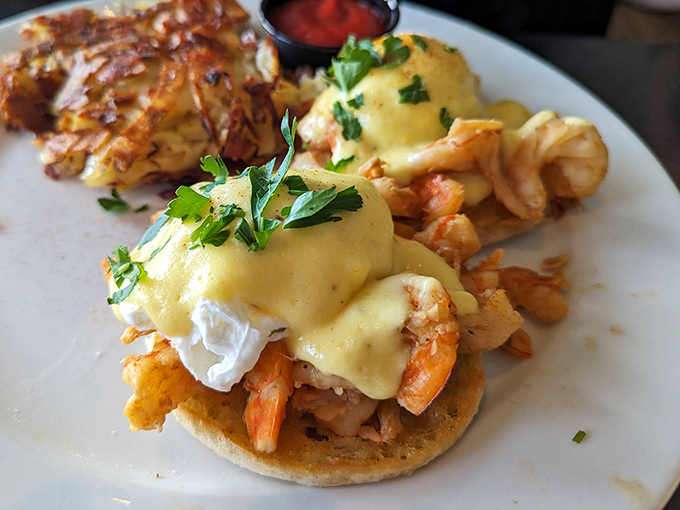 Eggs Benedict gets a coastal California makeover with succulent shrimp and hollandaise that flows like liquid gold over an English muffin throne.