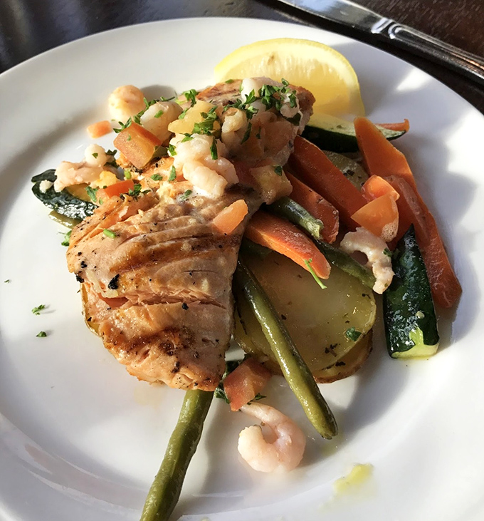 This king salmon doesn't just steal the show&mdash;it produces, directs, and writes it too. Perfectly seared and resting on a bed of colorful vegetables.