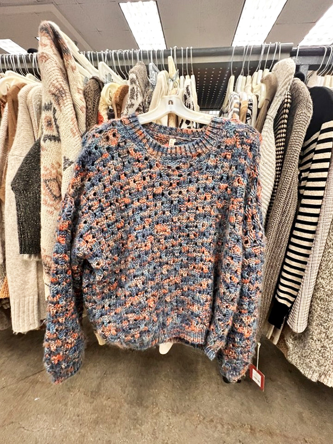 This textured sweater hangs among its peers, a tactile temptation for anyone who appreciates craftsmanship over fast fashion trends.
