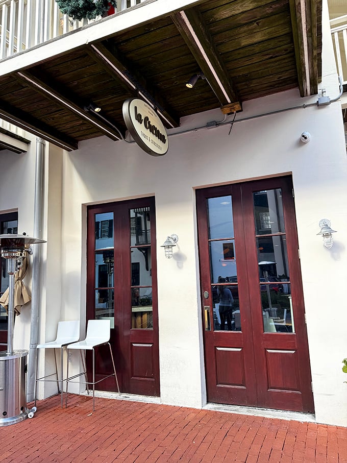 La Crema's inviting entrance promises Spanish-inspired delights within. Those wooden doors might as well be portals to tapas heaven&mdash;no passport required.