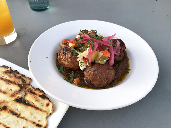 These lamb kofta are flavor bombs&mdash;tender, spiced meatballs topped with pickled onions and fresh herbs that would make any Mediterranean grandmother proud.
