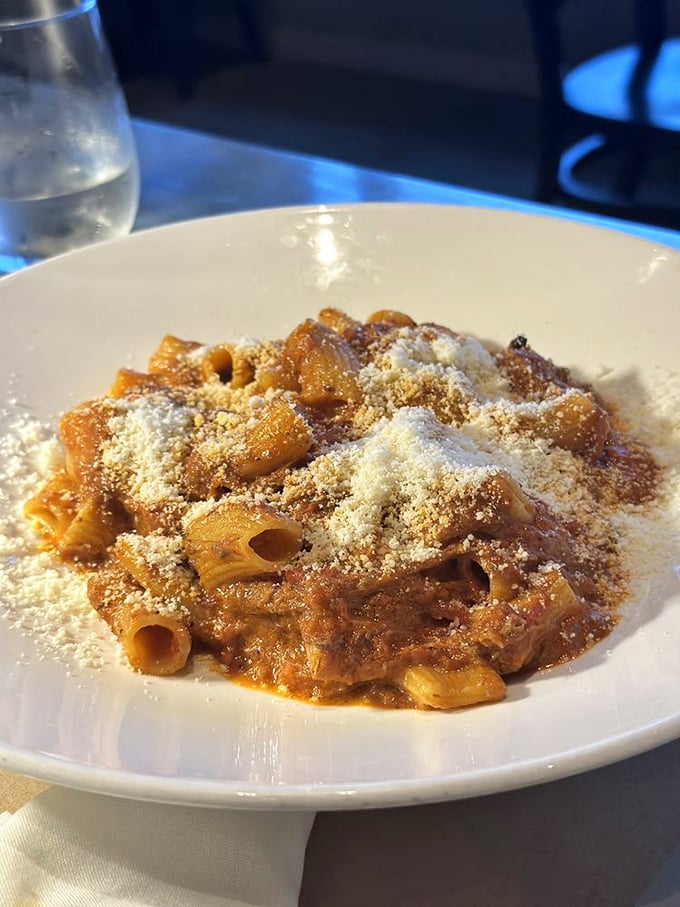 Rigatoni with lamb ragu showered in Parmesan&mdash;comfort food that hugs you from the inside. Each bite delivers that "close your eyes and sigh" moment Italian food promises.