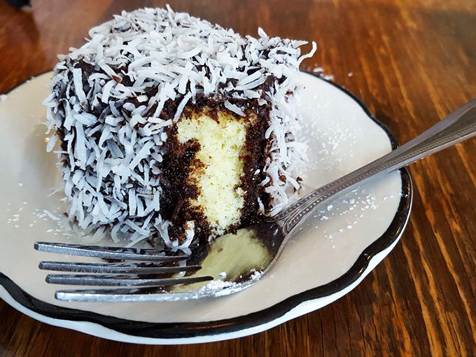 The lamington&mdash;Australia and New Zealand's gift to the world. Chocolate-dipped sponge cake rolled in coconut creates a textural paradise worth every calorie.