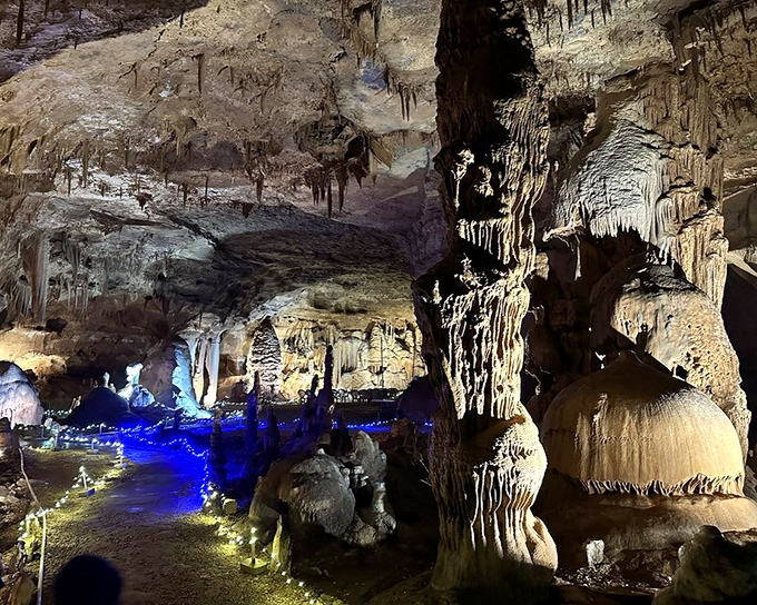 The dramatic lighting highlights millions of years of patient artistry. This chamber feels like the grand ballroom of an underground palace.