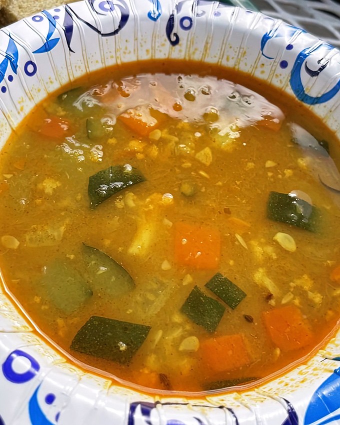 A bowl of golden lentil soup that proves humble ingredients can create liquid gold. Those vegetables aren't just swimming&mdash;they're performing synchronized flavor dances.