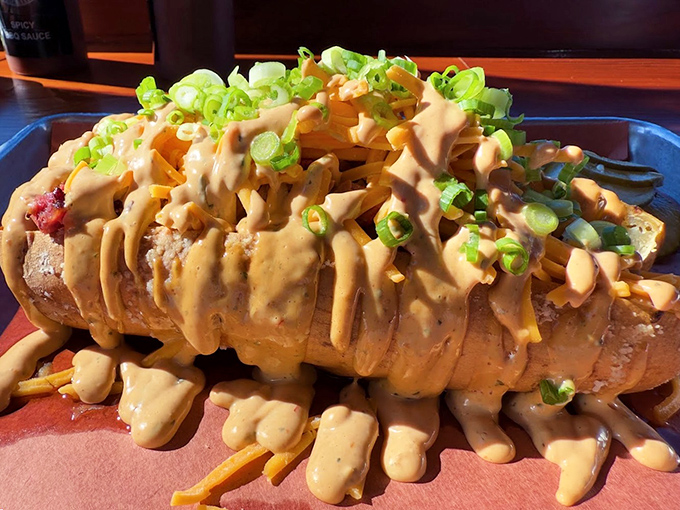 The "Dirty Frites" &ndash; where French fries meet their destiny under a blanket of cheese sauce, brisket, and chipotle aioli.