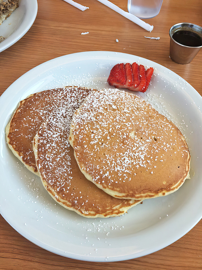 Golden pancakes dusted with powdered sugar and crowned with fresh strawberries&mdash;the breakfast equivalent of winning the lottery.