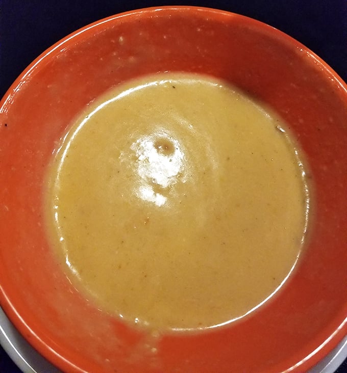 The lobster bisque arrives like liquid velvet in a bowl, promising (and delivering) oceanic richness with each spoonful.