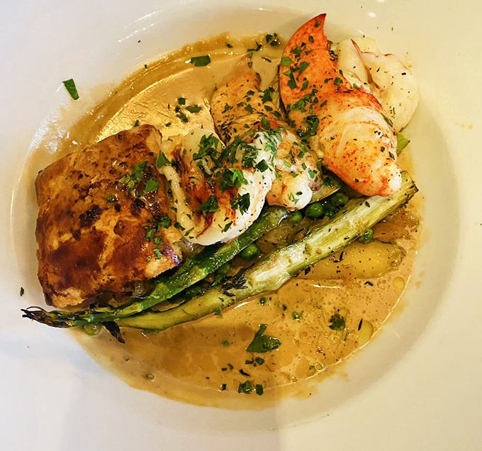 A seafood masterpiece that marries delicate lobster with spring vegetables in a buttery sauce&mdash;proof that sometimes the ocean's finest treasures belong on land.