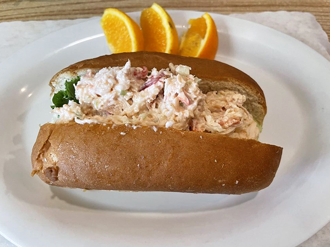 Fresh lobster nestled in a toasted roll like nature's own luxurious sleeping bag for crustaceans.