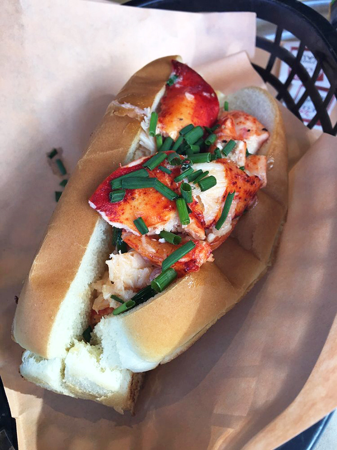 The lobster roll that launched a thousand return visits&mdash;buttery, fresh, and adorned with chives like jewelry on culinary royalty.
