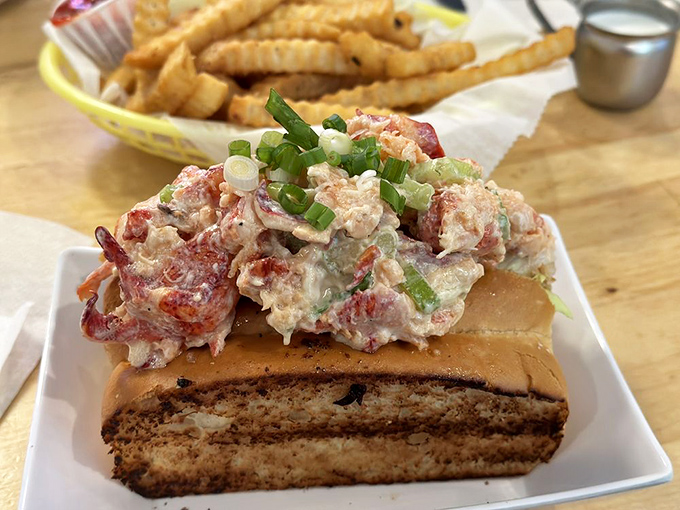 Lobster roll perfection: chunks of sweet lobster meat nestled in a buttery roll. The kind of dish that makes you consider moving to coastal Maine.