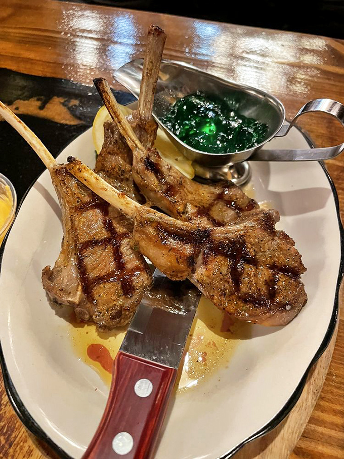 Lamb chops standing at attention like meaty soldiers, ready to sacrifice themselves for your dining pleasure. The ultimate finger food for grown-ups.