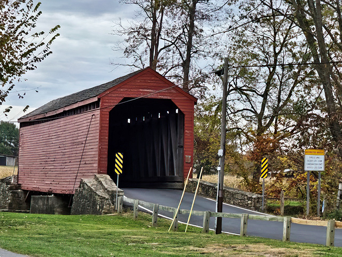 Rain or shine, this steadfast structure stands sentinel over Owens Creek. Yellow caution markers remind modern drivers this bridge deserves our respect.
