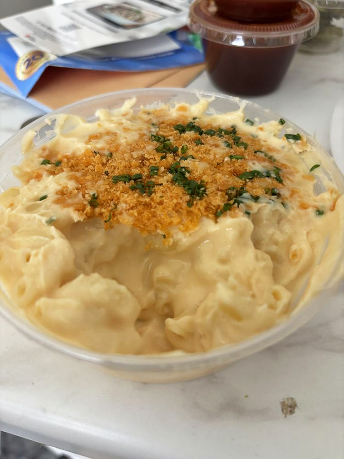 Mac and cheese that achieves the impossible trifecta: creamy, cheesy, and substantial enough to hold its own against the smokehouse heavyweights on your plate.