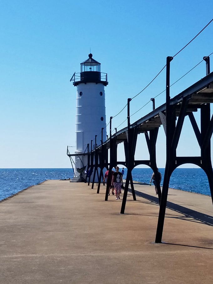 The North Pierhead Lighthouse stands sentinel at the harbor entrance, guiding vessels and photographers alike for generations.