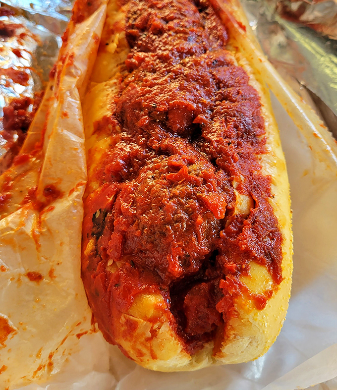 This meatball sandwich isn't trying to reinvent Italian-American cuisine; it's perfecting it. Red sauce so vibrant it could stop traffic.