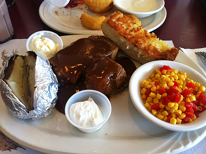 Meatloaf that would make your grandmother jealous, swimming in rich gravy alongside colorful vegetables and buttery cornbread.