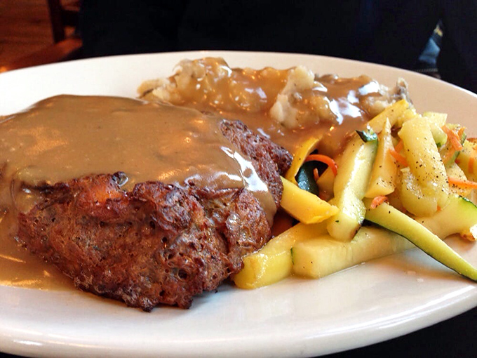 Meatloaf that would make your grandmother both jealous and proud. That gravy river flowing into vegetable tributaries is geography you'll want to explore.