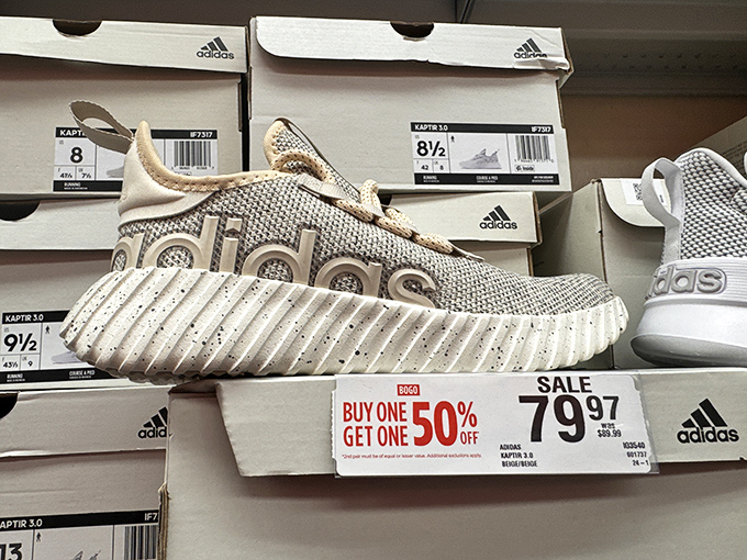 Adidas sneakers with "Buy One Get One 50% Off"—because the only thing better than new shoes is... more new shoes.