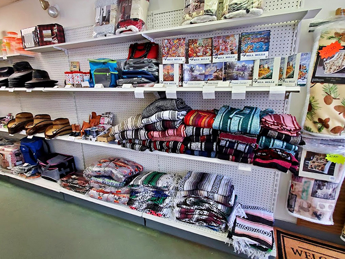 Blankets and textiles stacked with military precision. Each folded rectangle promises to add a pop of color to someone's home or a layer of warmth on chilly Pocono evenings.