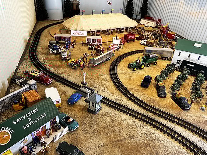 This intricate miniature railroad display showcases the meticulous craftsmanship that train enthusiasts bring to their passion, creating worlds in miniature.