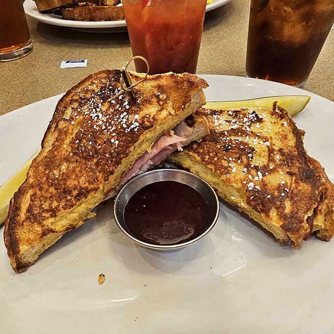 The Monte Cristo: where French toast meets ham and cheese in a relationship so perfect it should have its own reality show.