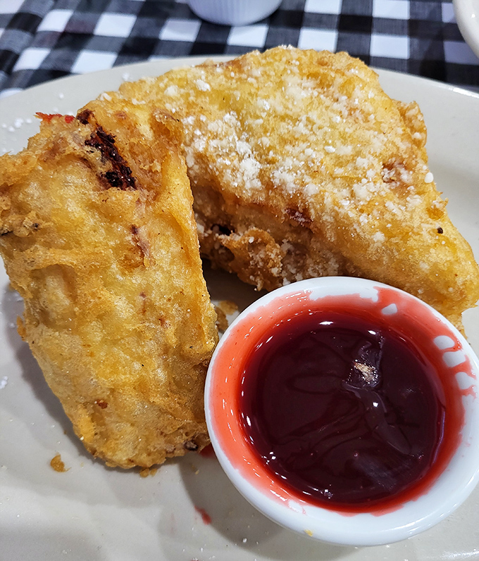The Monte Cristo at Mel's is what happens when a sandwich goes to heaven&mdash;deep-fried perfection with that sweet raspberry sauce creating a flavor combination that's practically symphonic.