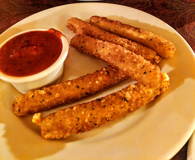 Golden, crispy cheese sticks that stretch dramatically when pulled apart—the kind of appetizer that makes you question sharing altogether.