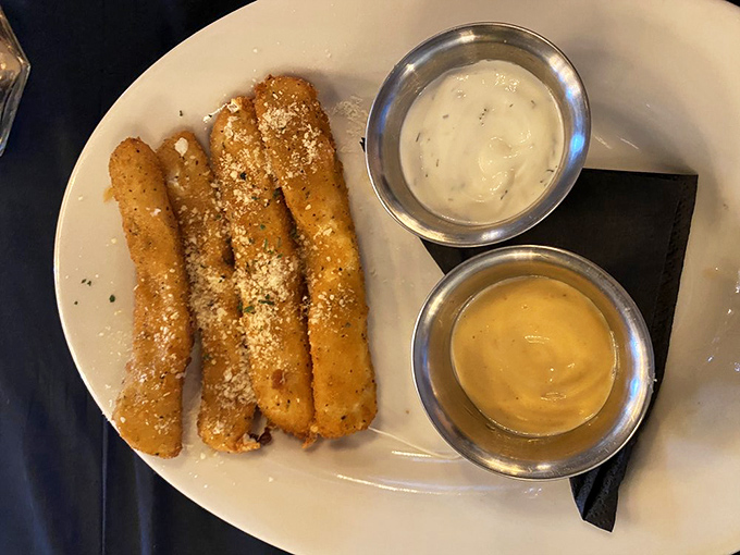 These aren't your average mozzarella sticks &ndash; they're golden-brown ambassadors of cheese, dusted with parmesan and served with dipping sauces that mean business.