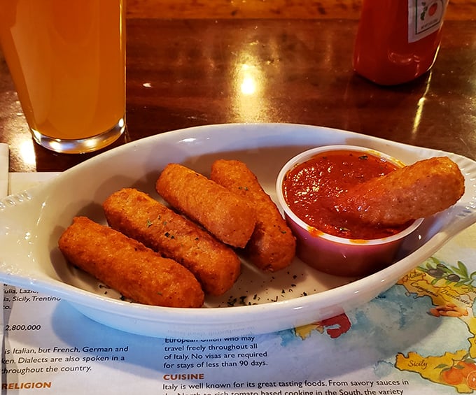 These golden mozzarella sticks aren't just appetizers; they're crunchy vessels delivering molten cheese directly to your happiness receptors.