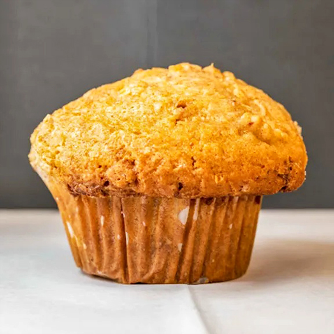 The muffin top isn't just the best part—it's practically breaking free from its paper restraints. Carbs with ambition and no apologies.