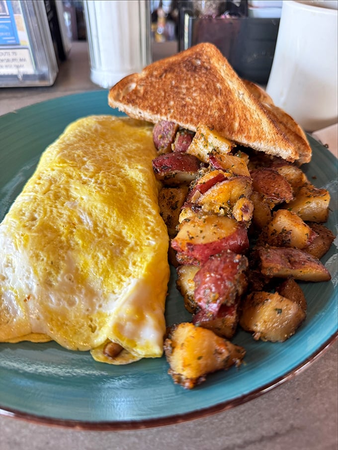 This omelet doesn't just contain cheese&mdash;it embraces it, while those home fries have clearly been introduced to seasonings that respect their potential.