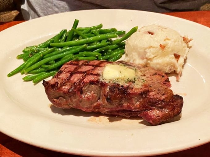 A New York Strip with green beans and a loaded potato&mdash;the holy trinity of steakhouse perfection that never goes out of style.