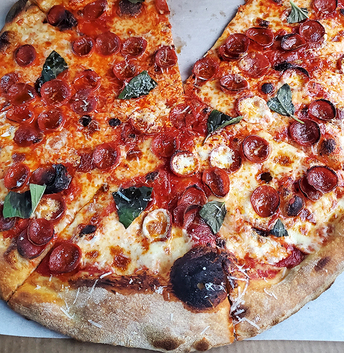 Behold the perfect New York-style slice &ndash; thin enough to fold, substantial enough to satisfy, and topped with just the right amount of everything good.