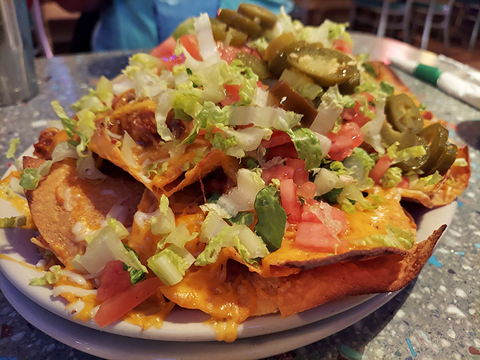 The Belgian waffle arrives like royalty, golden-crowned with butter slowly melting into those perfect squares&mdash;a breakfast that demands to be savored.