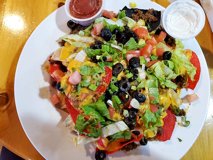 Nachos that don't understand the concept of personal space&mdash;every chip is smothered in toppings as if afraid of being caught underdressed at the party.