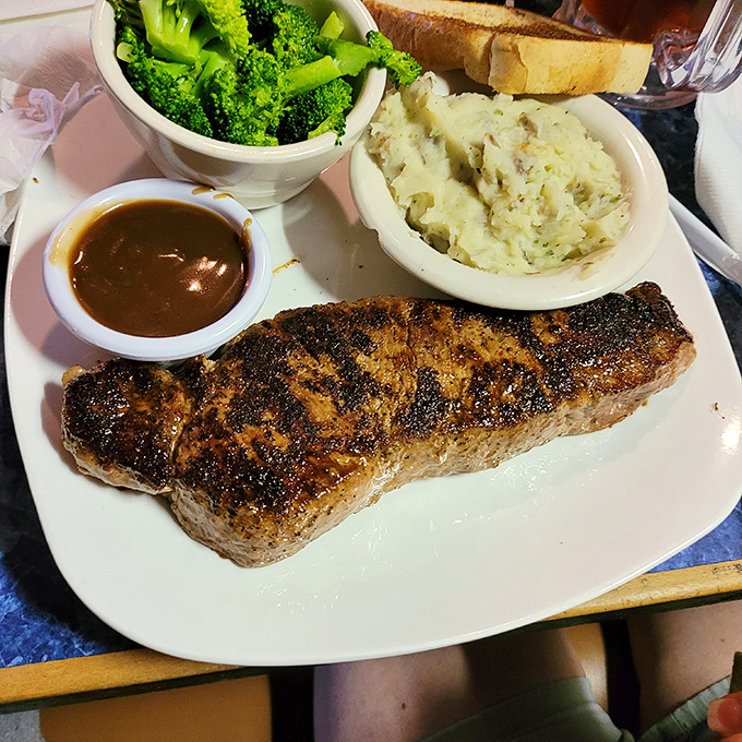 A New York strip that's traveled south and found its happy place. The char speaks of fire-kissed perfection while the sides play their complementary roles.